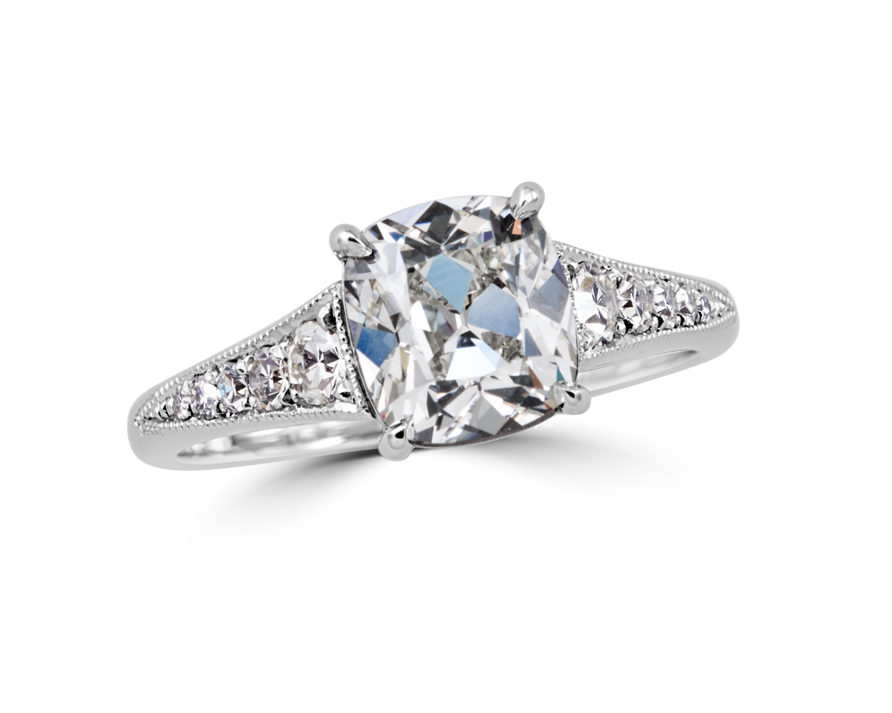 A Cushion Solitaire Engagement Ring with a Reverse Tapered Band